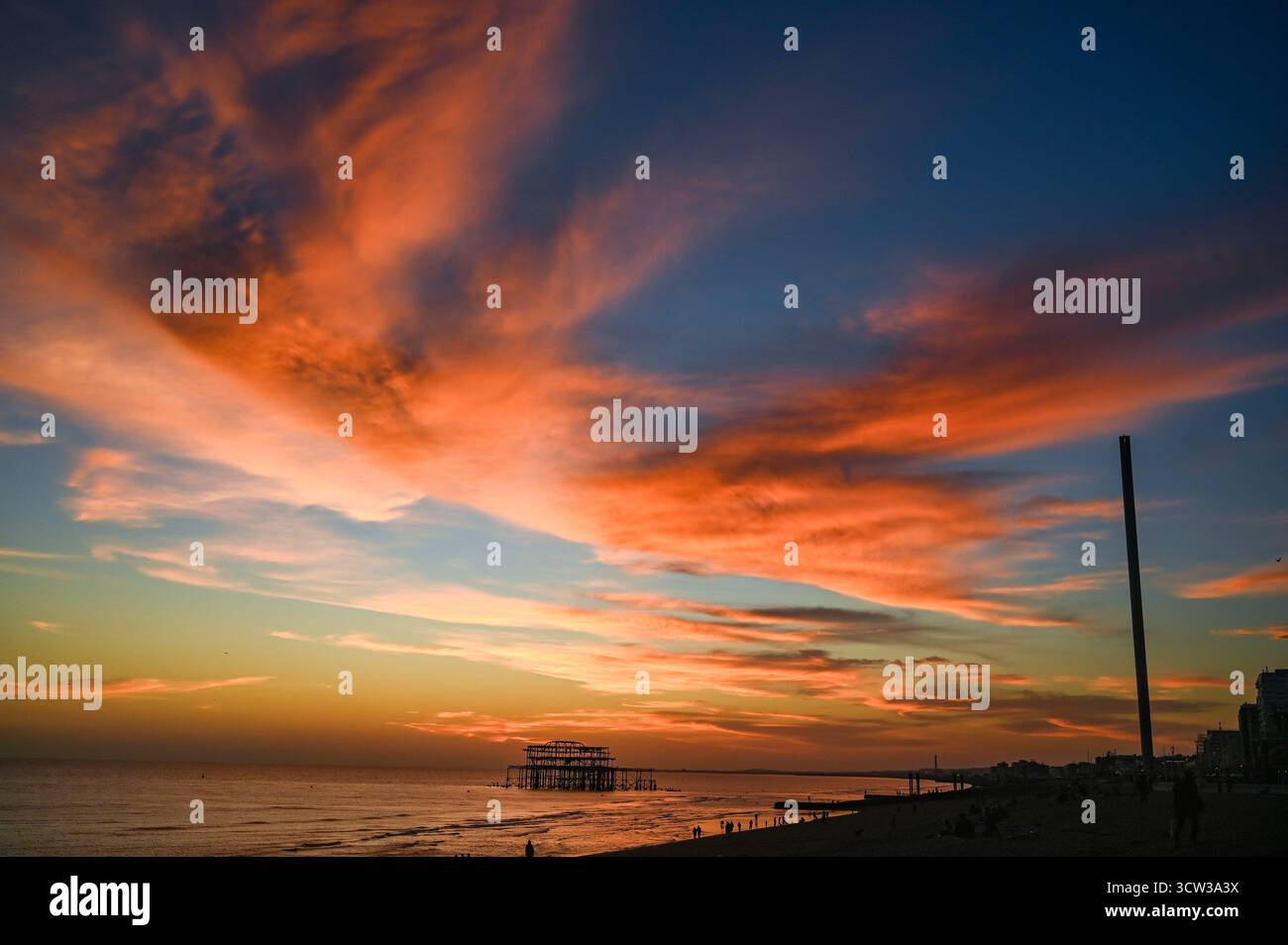 Brighton UK 9th October 2025 - Visitors enjoy a beautiful sunset over ...