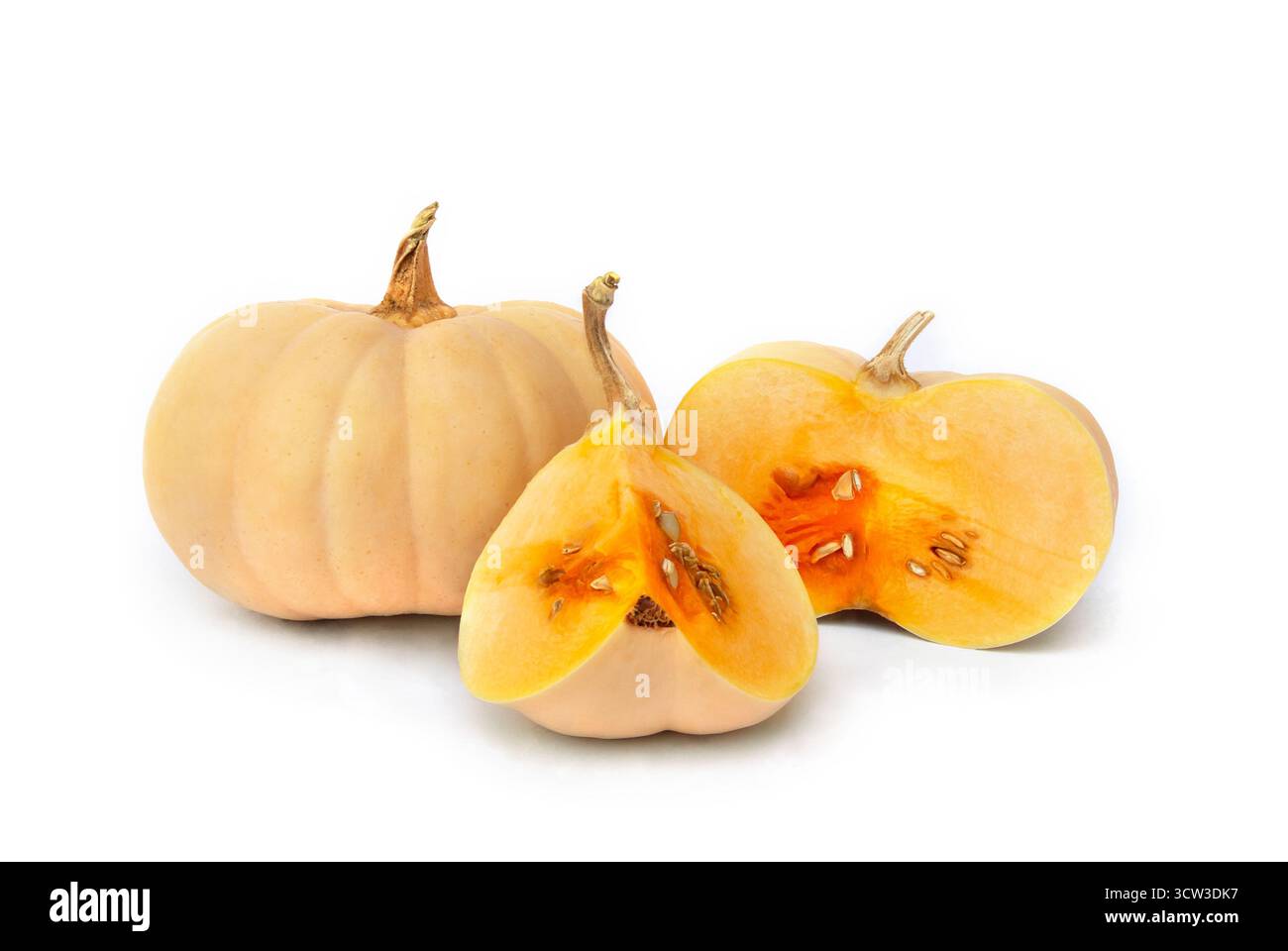 Fresh whole, half and sliced pumpkins on a white background with space ...