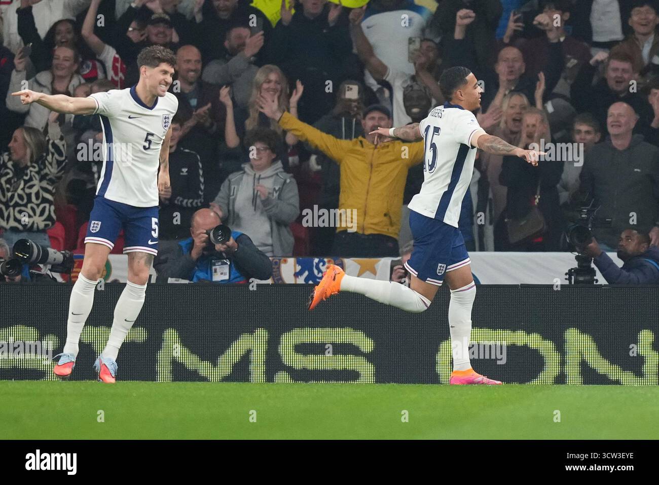 England's Morgan Rogers, right, celebrates after scoring his side's ...