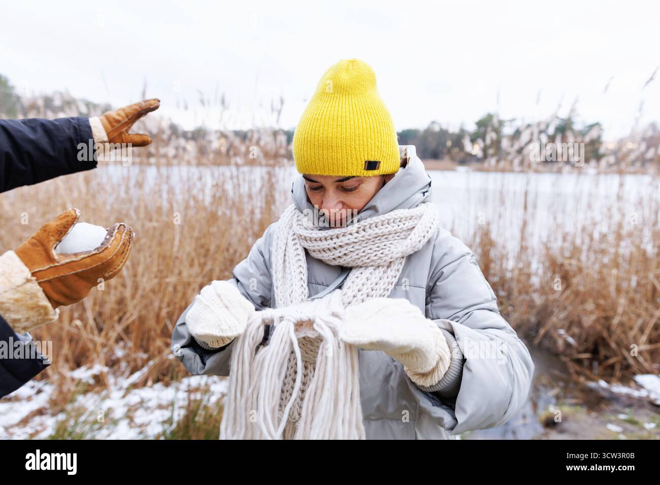 Woman adjusting puffer jacket hi-res stock photography and images - Alamy
