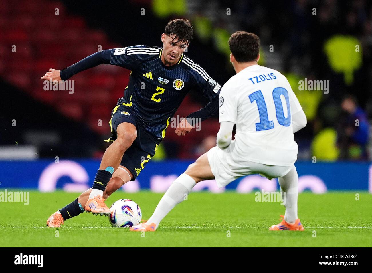Scotland's Aaron Hickey (left) and Greece's Christos Tzolis battle for ...