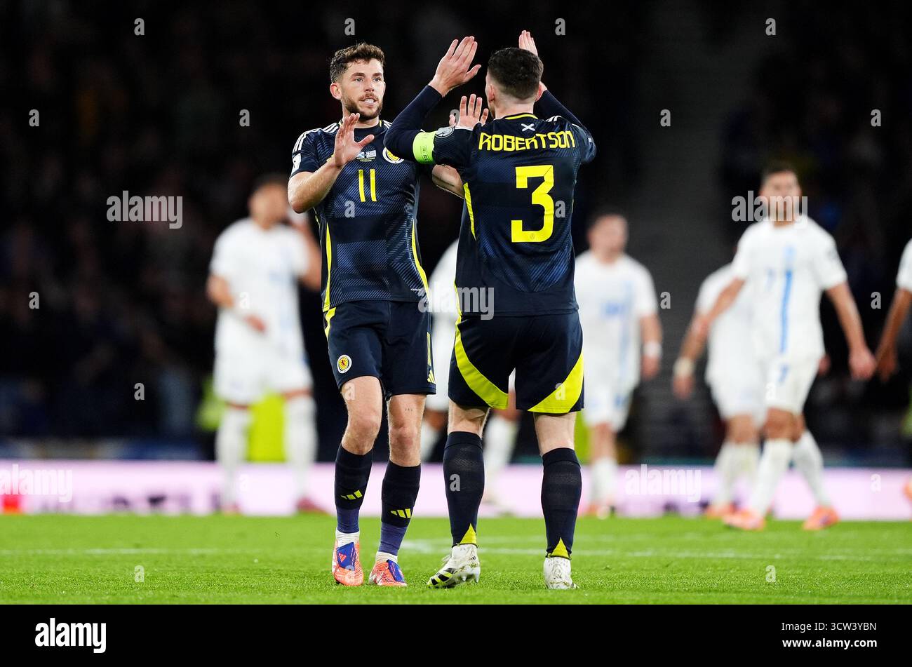 Scotland's Ryan Christie (left) celebrates scoring their side's first ...