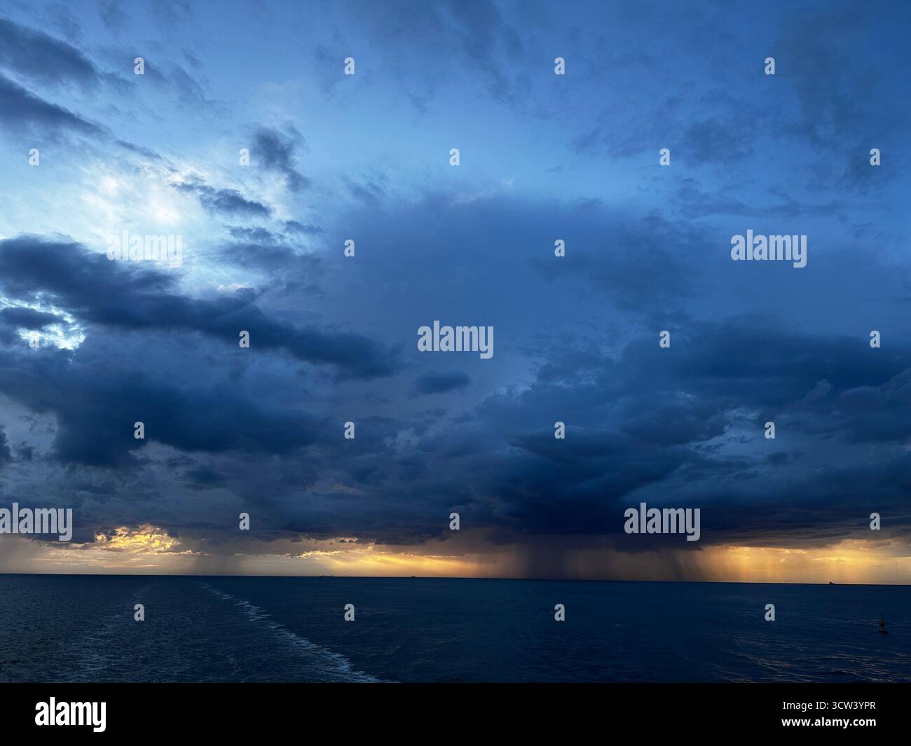 Dramatic rainstorm over the open sea near Le Havre, France, with dark ...