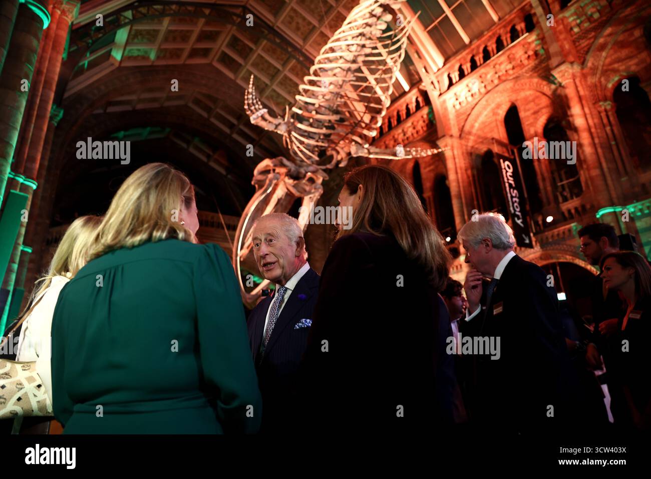 King Charles III speaks with guests during the Countdown to Cop30 event ...