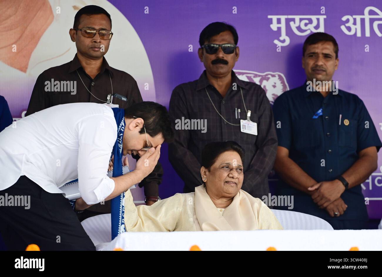 LUCKNOW, INDIA - OCTOBER 9: Akash Anand touches the feet of BSP supremo ...