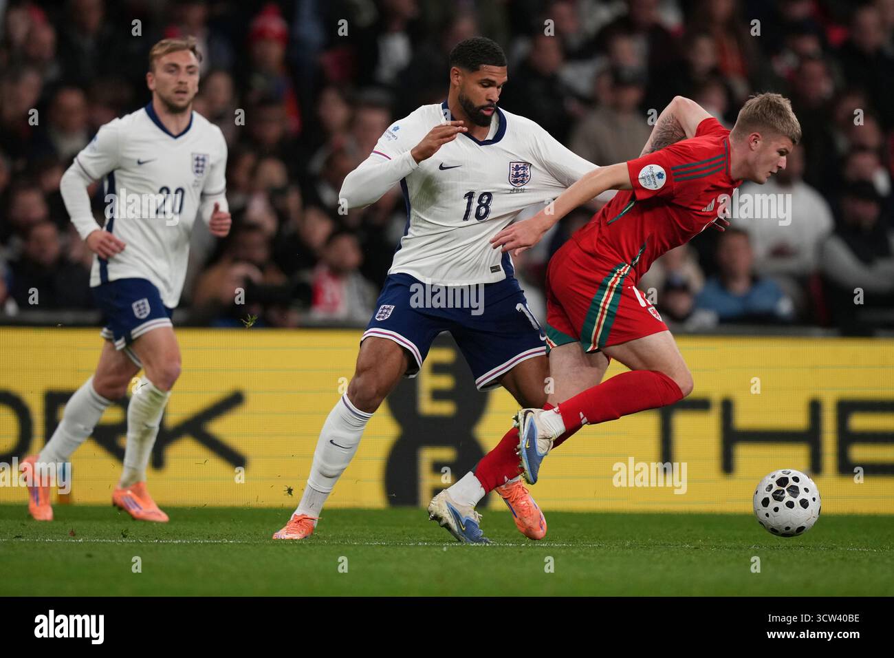 Wales's Jordan James, right, is challenged by England's Ruben Loftus ...