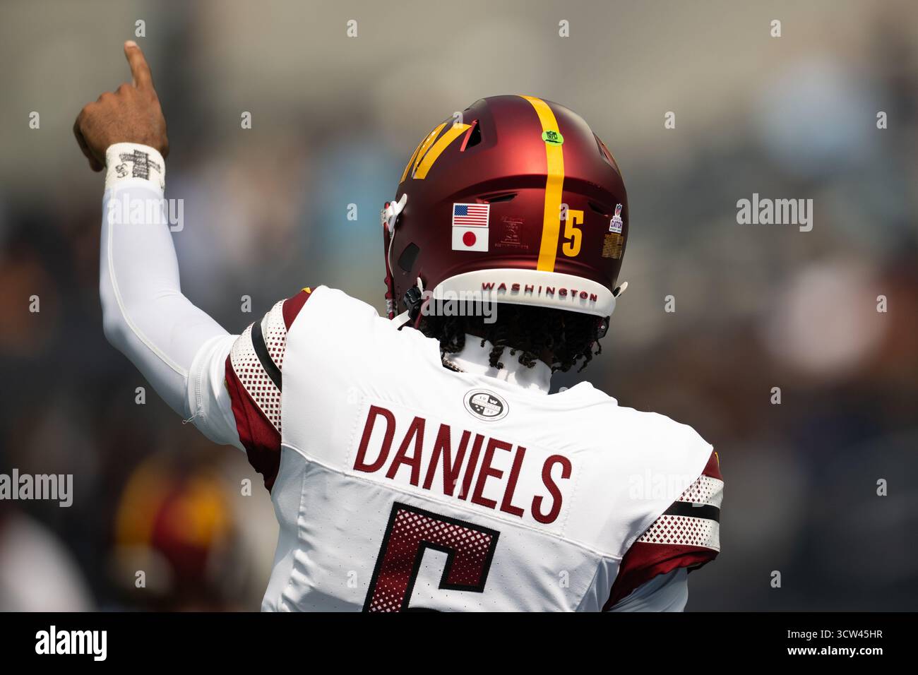Washington Commanders quarterback Jayden Daniels (5) wears Japanese ...