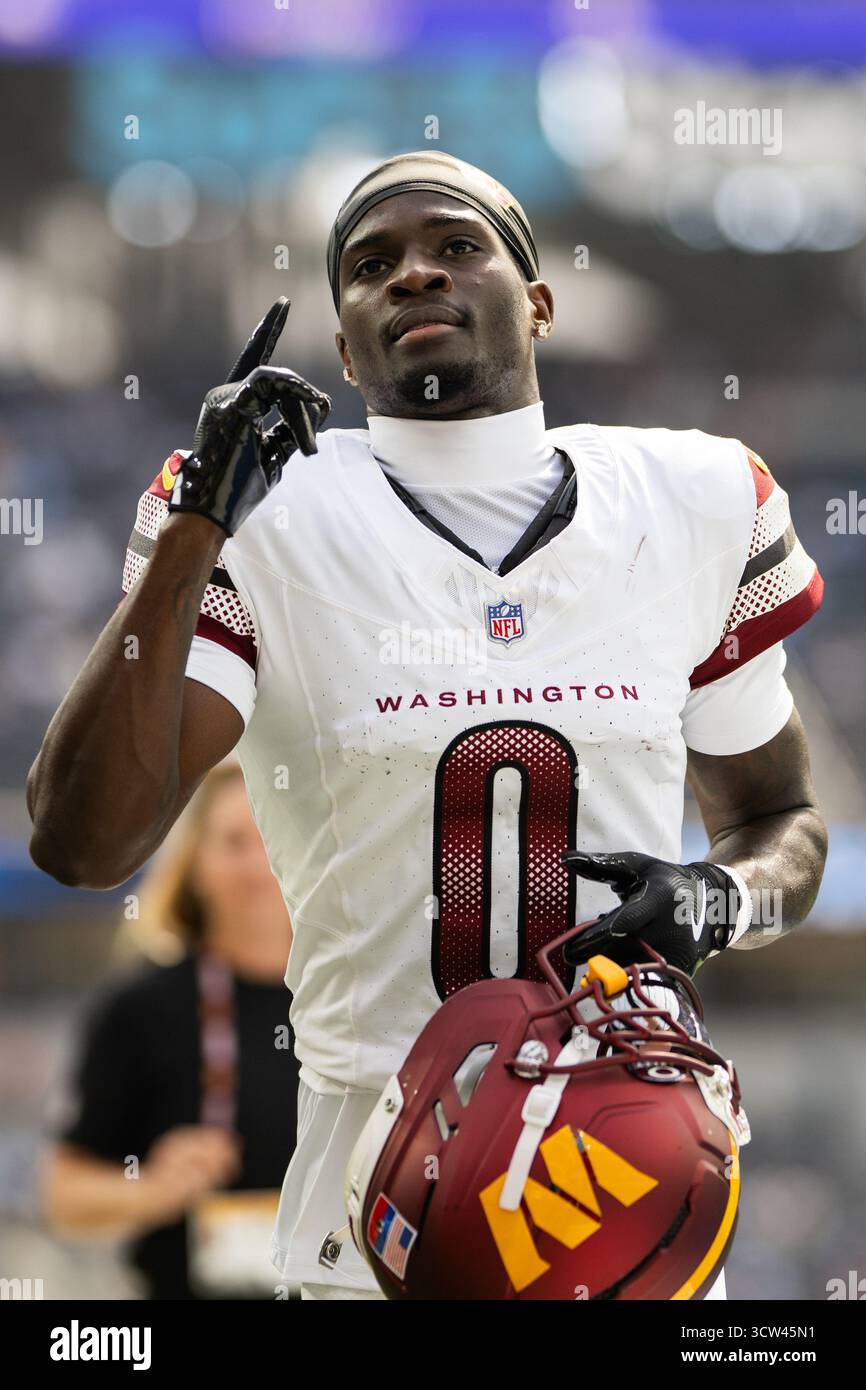 Washington Commanders cornerback Mike Sainristil (0) jogs back to the ...