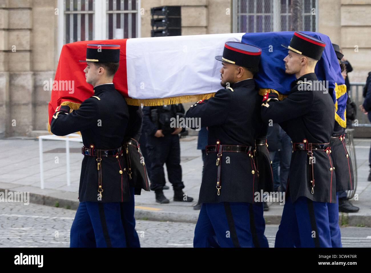 French Republican Guard carry a flag-draped ceremonial casket on rue ...