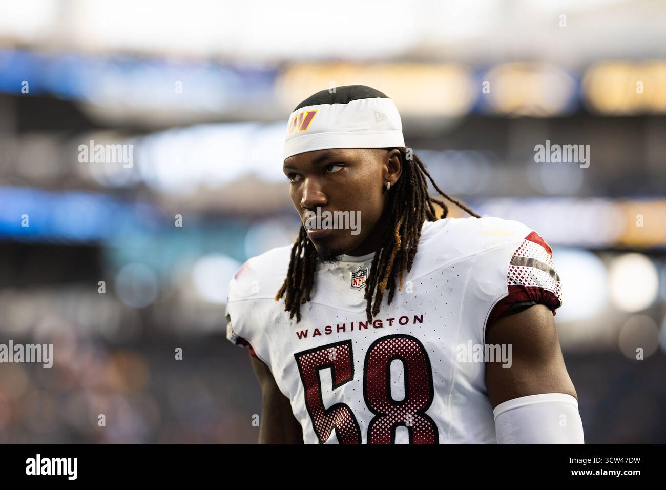 Washington Commanders linebacker Jordan Magee (58) walks back to the ...