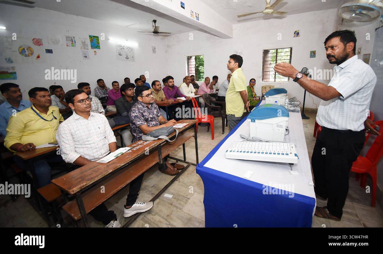 PATNA, INDIA - OCTOBER 9: Election officers demonstrate the Electronic ...