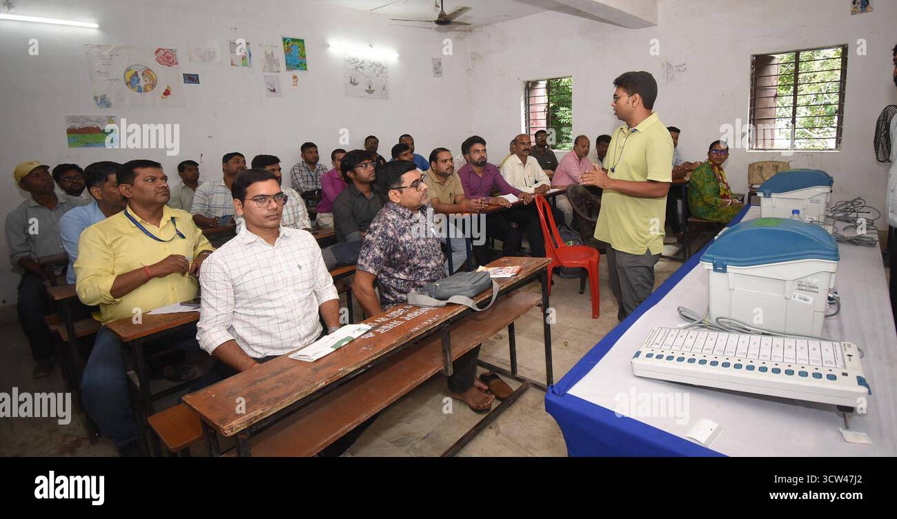 PATNA, INDIA - OCTOBER 9: Election officers demonstrate the Electronic ...