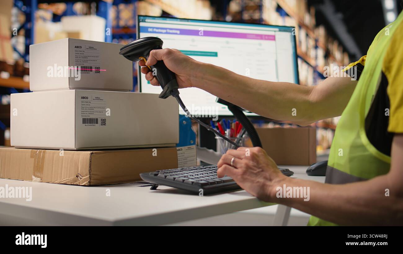 Male depot worker scanning barcodes hi-res stock photography and images ...