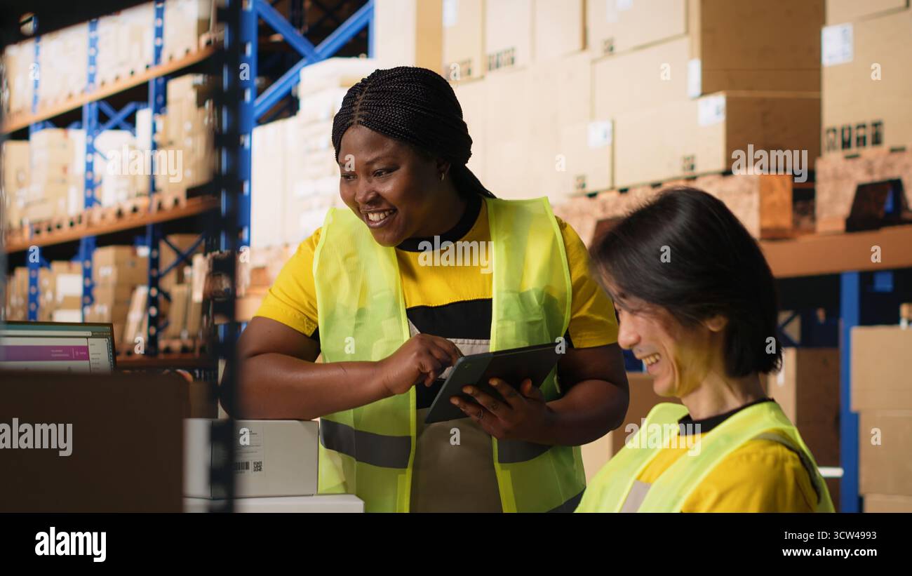Satisfied coworkers sharing a high five after successful order ...