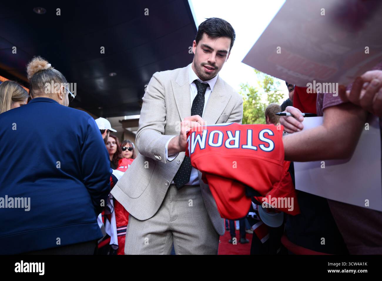 Washington Capitals center Hendrix Lapierre walks the red carpet and ...
