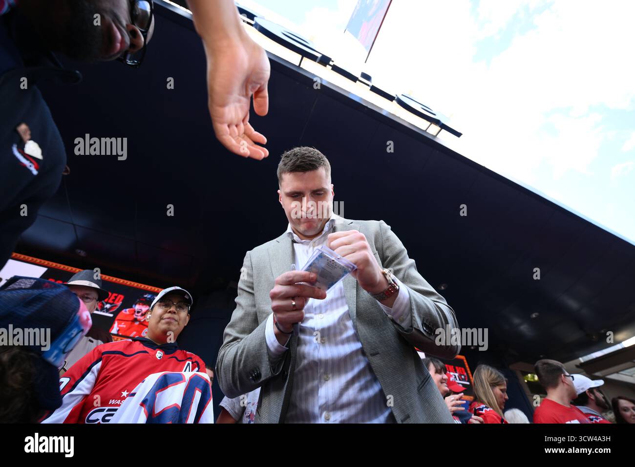 Washington Capitals center Aliaksei Protas walks the red carpet and ...