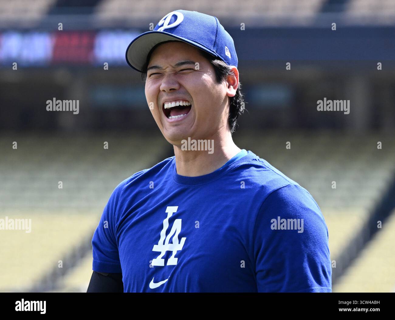 Los Angeles Dodgers' designated hitter Shohei Ohtani smiles during ...