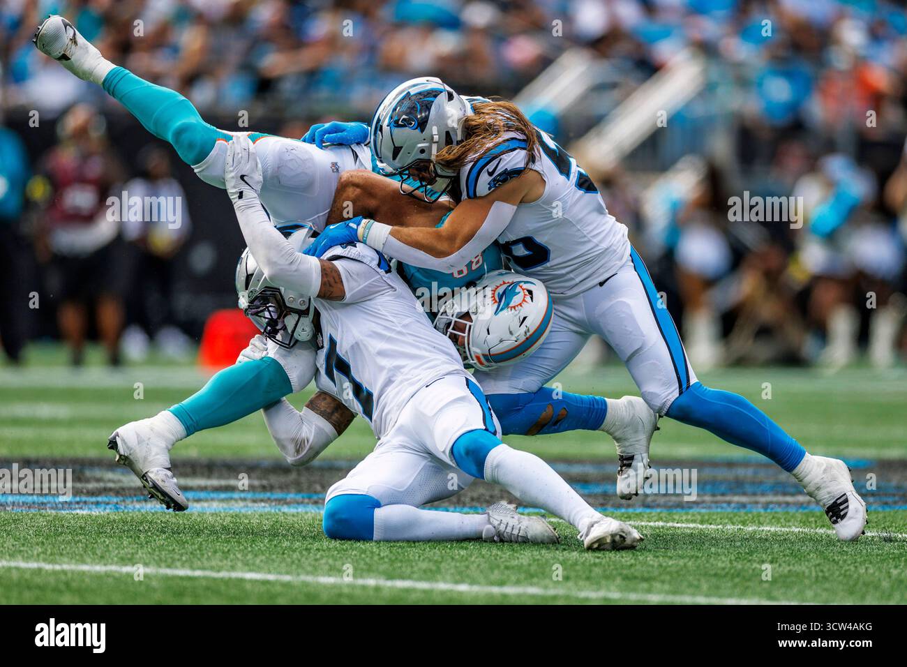Miami Dolphins tight end Julian Hill (89) is tackled by Carolina ...