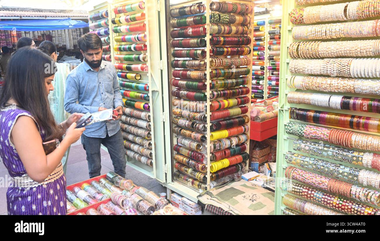 NEW DELHI, INDIA - OCTOBER 9: Women shop for bangles on the eve of Karva Chauth festival, at ...