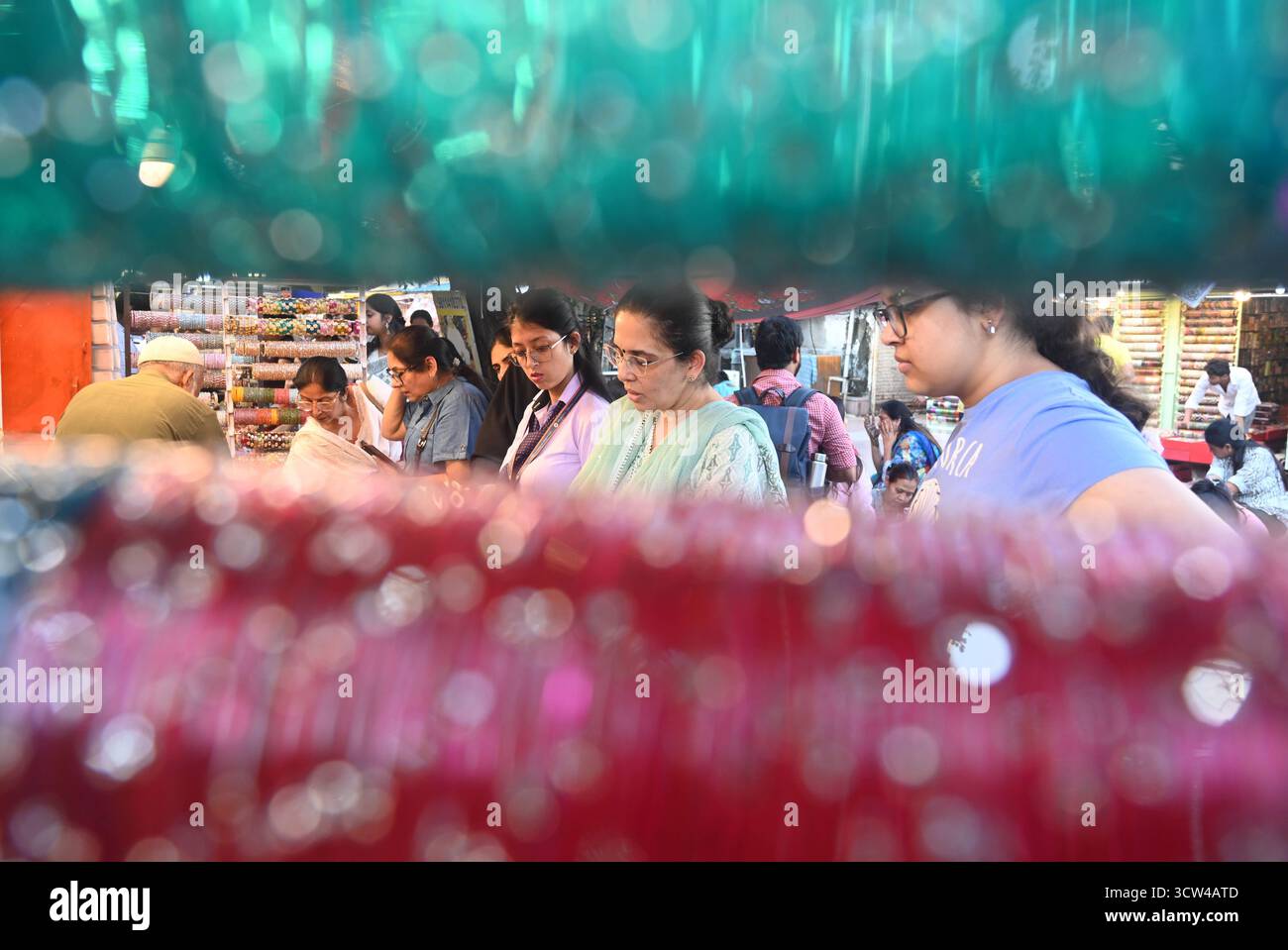 NEW DELHI, INDIA - OCTOBER 9: Women shop for bangles on the eve of Karva Chauth festival, at ...