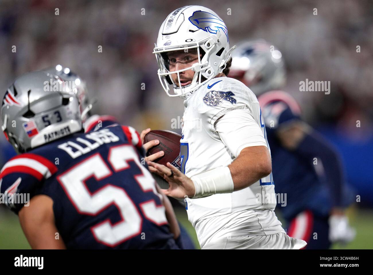 Buffalo Bills quarterback Josh Allen (17) stiff arms New England ...