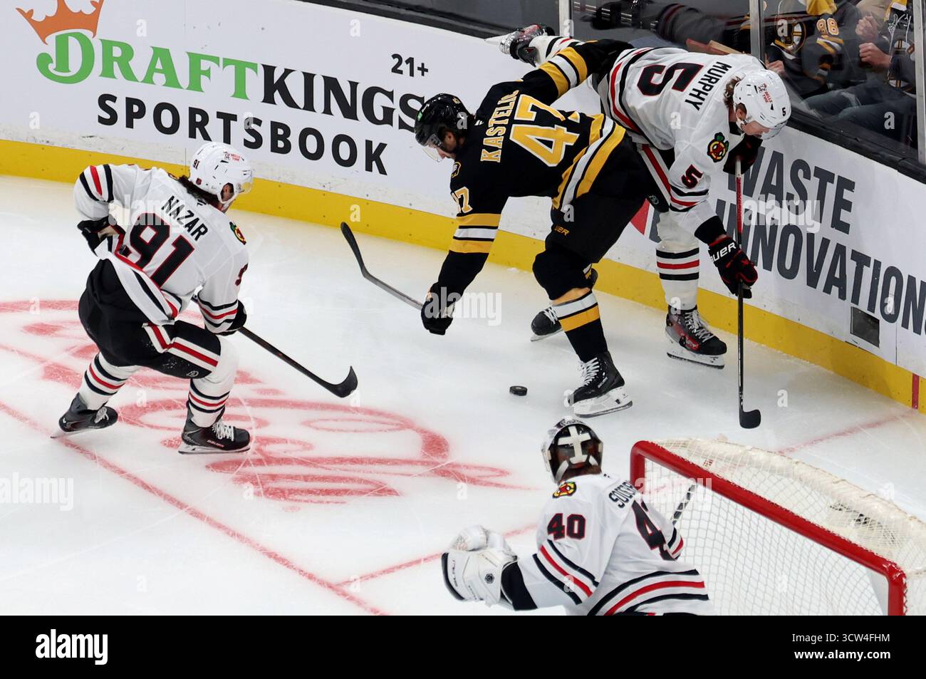 Boston Bruins center Mark Kastelic (47) and Chicago Blackhawks ...