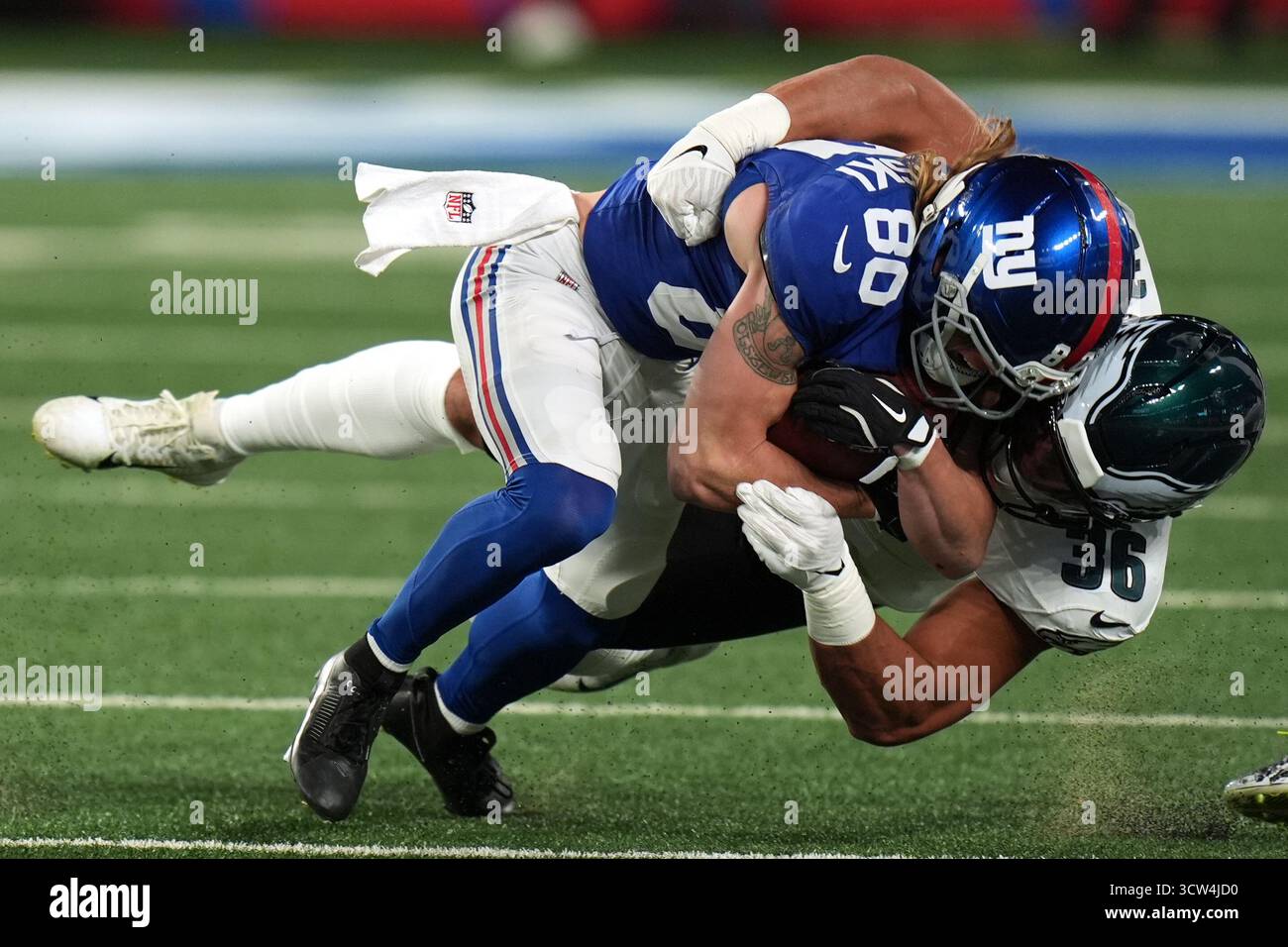 New York Giants' Gunner Olszewski, left, is tackled by Philadelphia ...