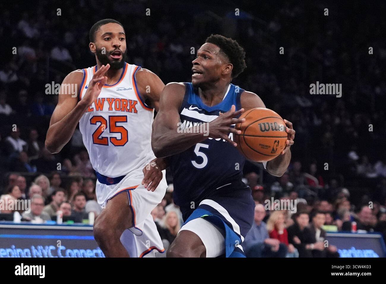 Minnesota Timberwolves' Anthony Edwards (5) drives past New York Knicks ...