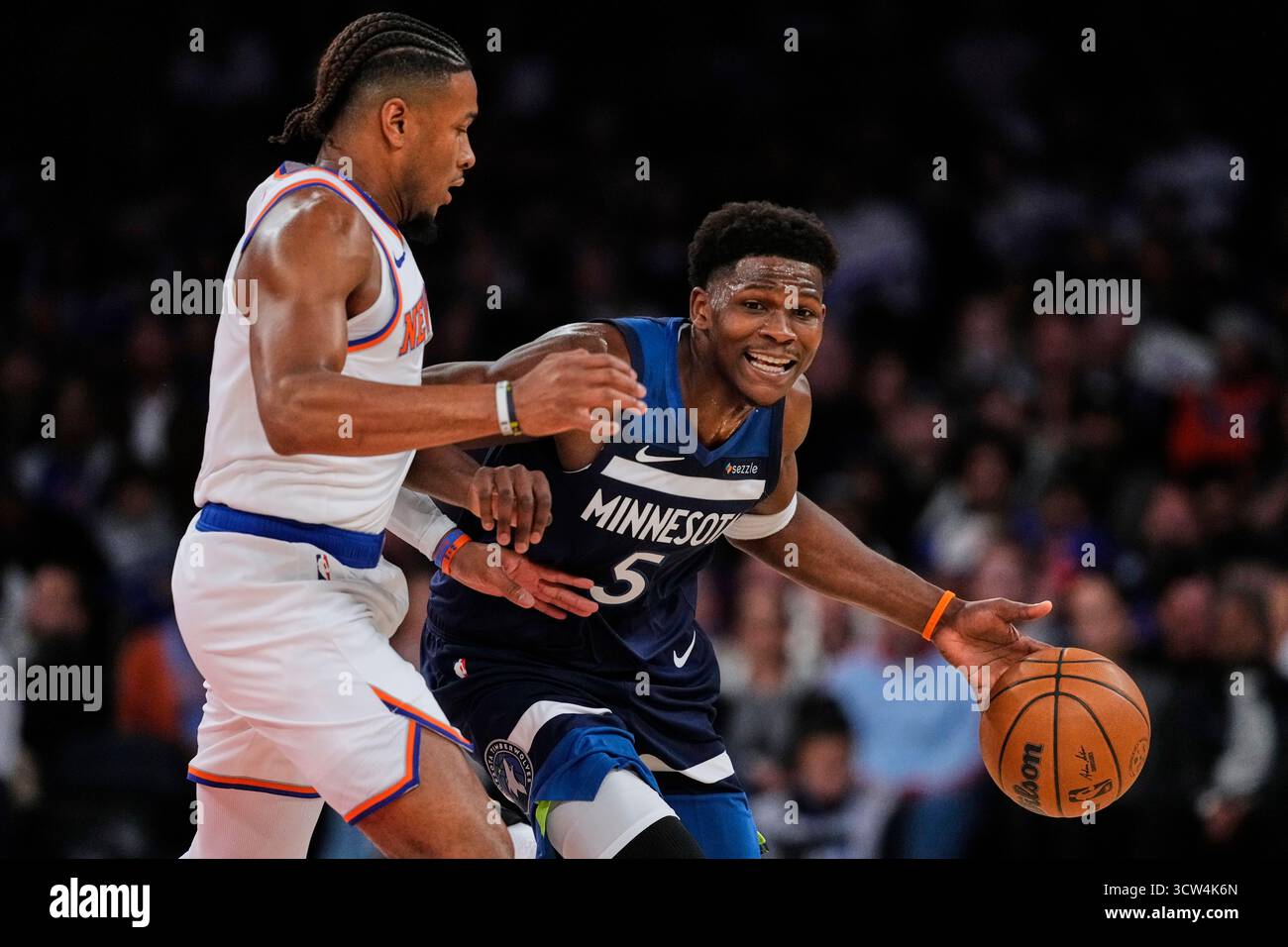 New York Knicks' Miles McBride, left, defends Minnesota Timberwolves ...