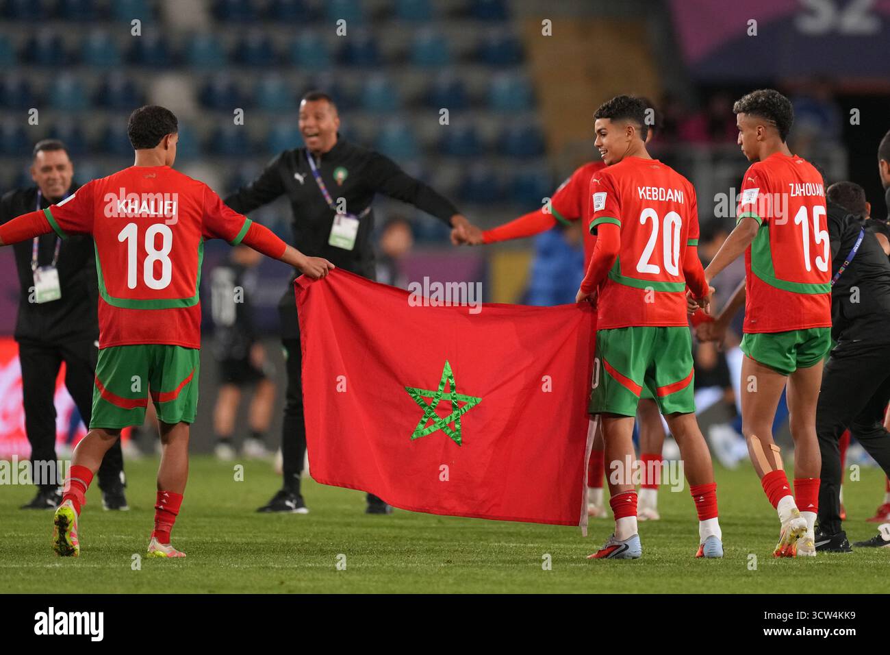 Morocco's players celebrate after their team defeated South Korea at ...