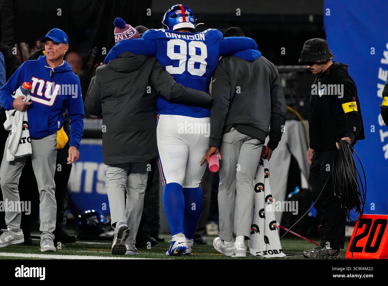 New York Giants' DJ Davidson is helped off the field during the first ...