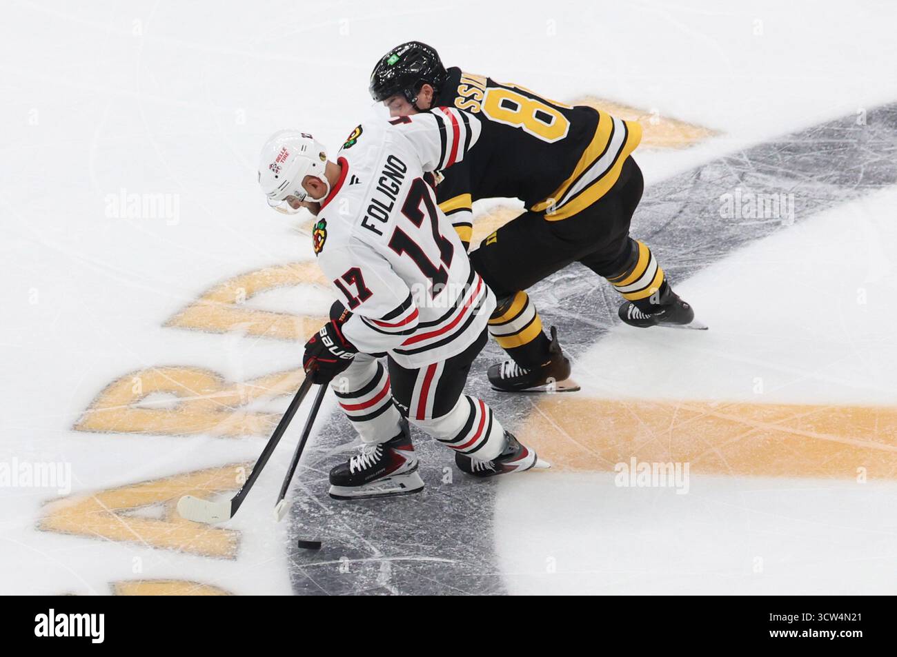 Chicago Blackhawks left wing Nick Foligno (17) and Boston Bruins center ...
