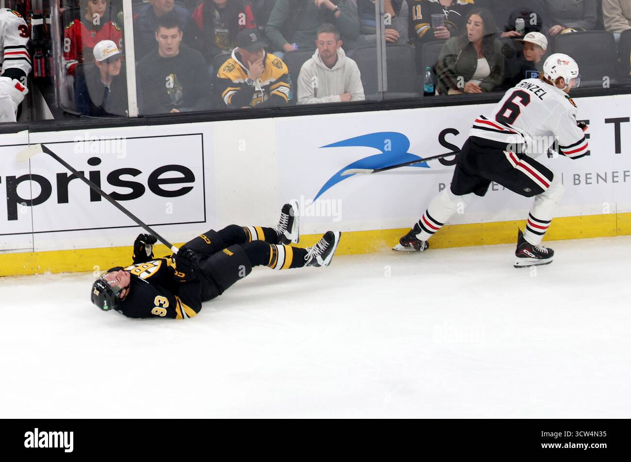 Boston Bruins center Fraser Minten (93) falls to the ice while chasing ...