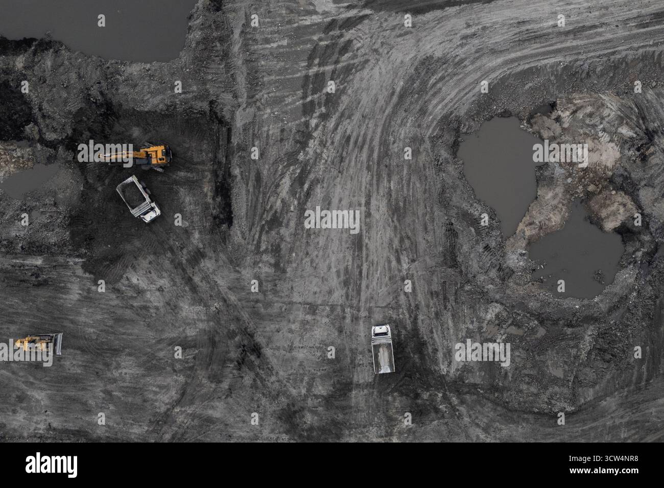 Autonomous mining trucks operate in the Huaneng Yimin open-pit coal ...