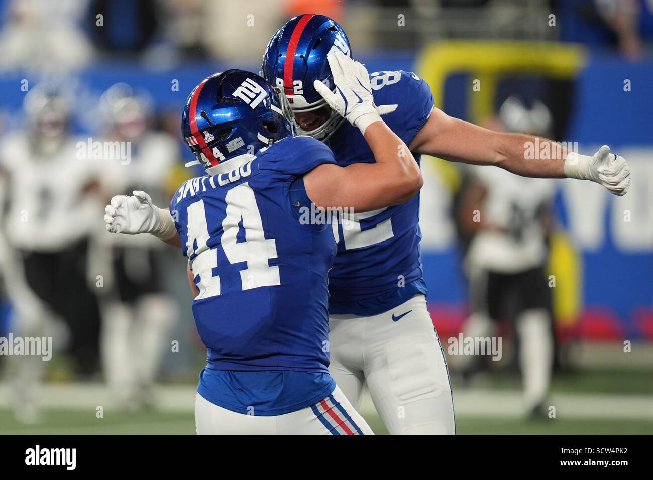 New York Giants' Cam Skattebo, left, and Daniel Bellinger celebrate ...