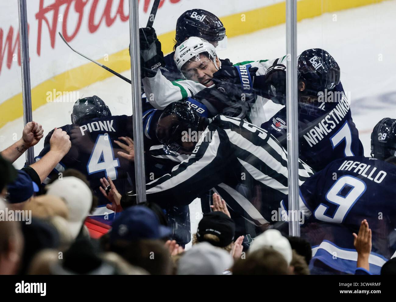 Winnipeg Jets' Vladislav Namestnikov (7) hits Dallas Stars' Jason ...