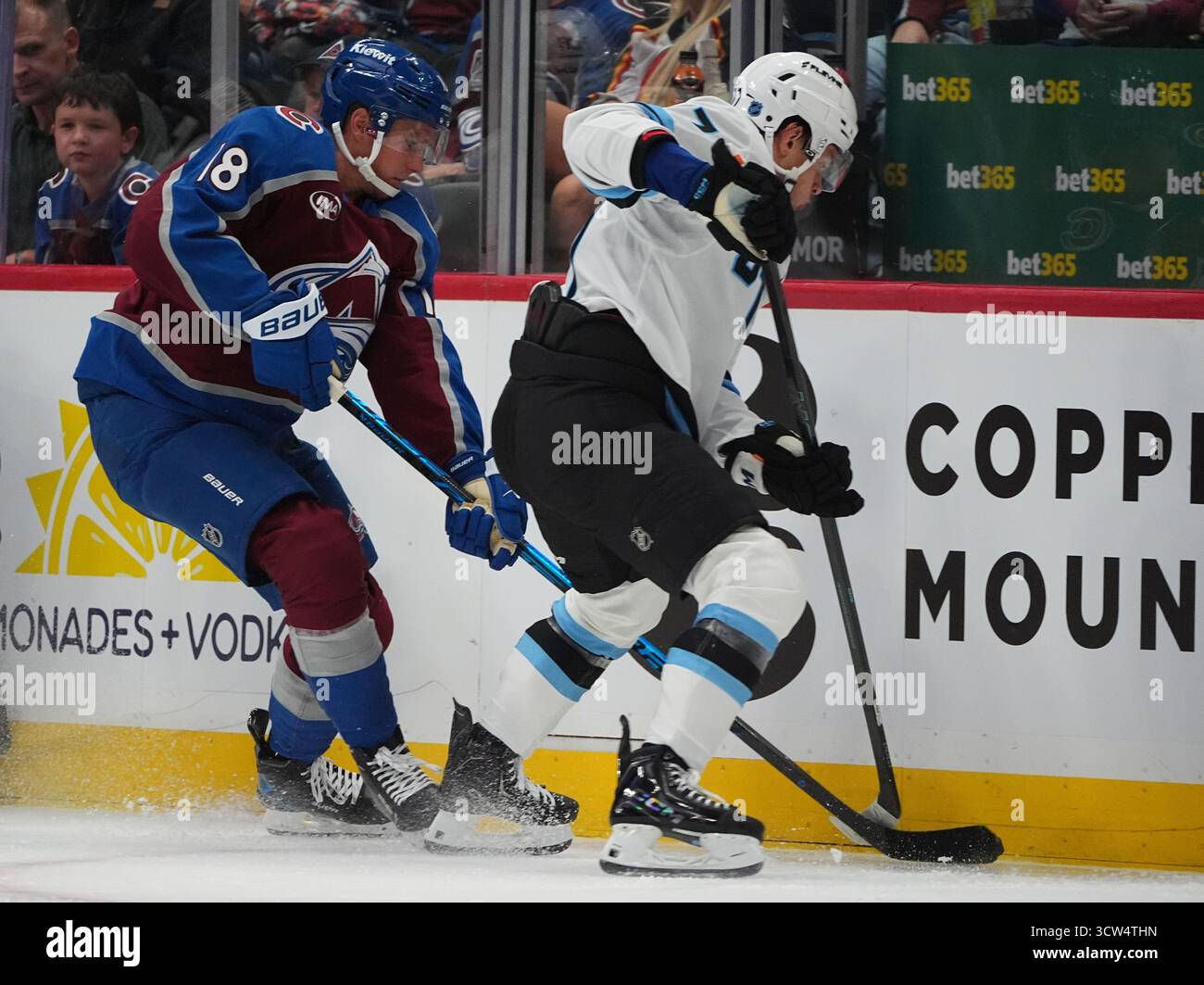 Colorado Avalanche center Jack Drury, left, fights for control of the ...