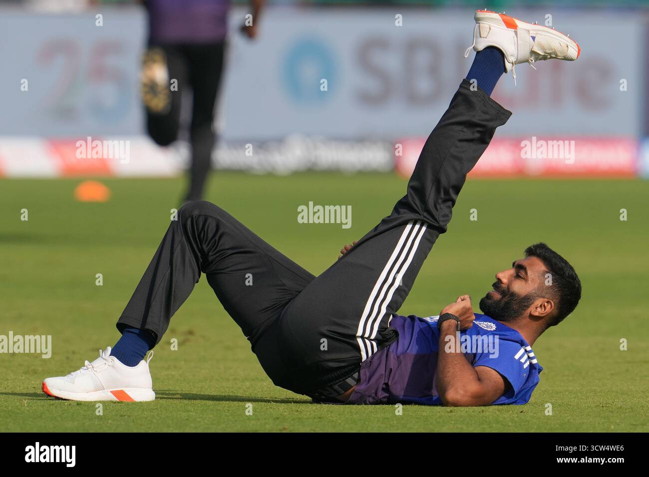 India's Jasprit Bumrah warms up before the start of the first day of ...