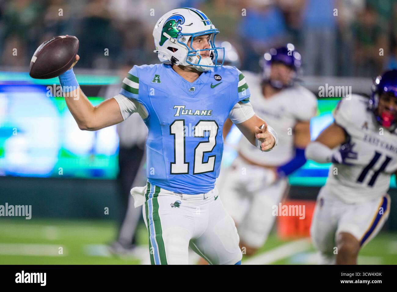 Tulane quarterback Jake Retzlaff (12) throws during the second half an ...