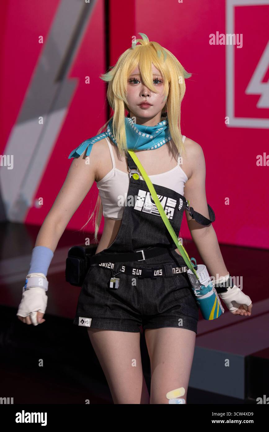 Chiba, Japan. 26th Sep, 2025. Cosplayer advertises the mobile game ...