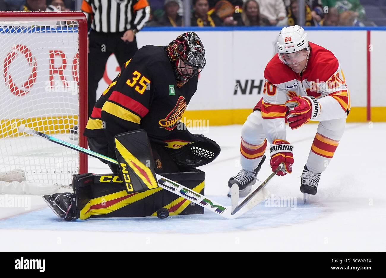 Vancouver Canucks goalie Thatcher Demko (35) makes the save as Calgary ...