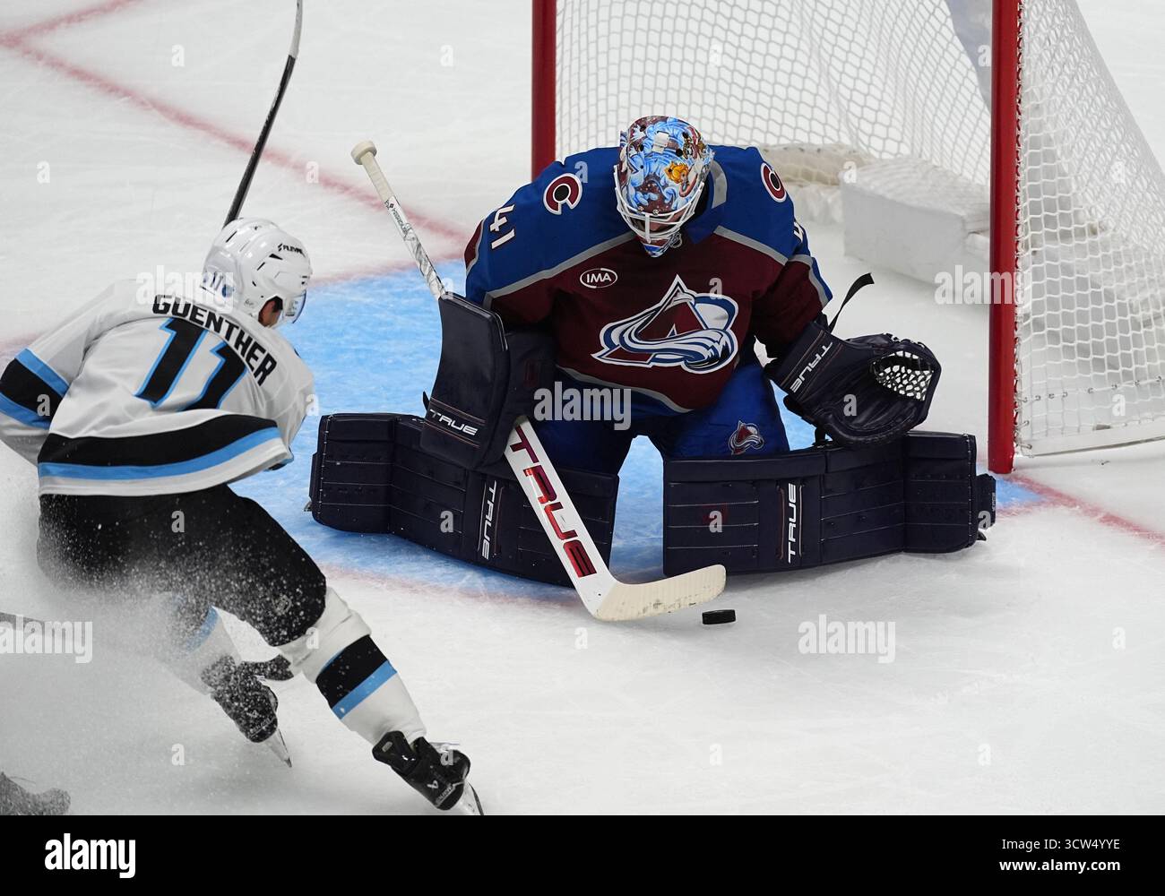 Utah Mammoth right wing Dylan Guenther, left, puts a shot on Colorado ...