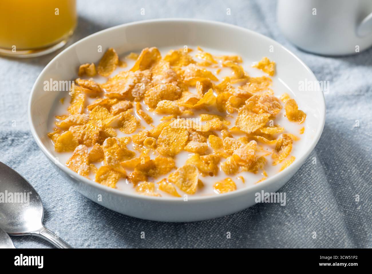 Healthy Frosted Corn Flake Breakfast Cereal with Whole Milk Stock Photo ...