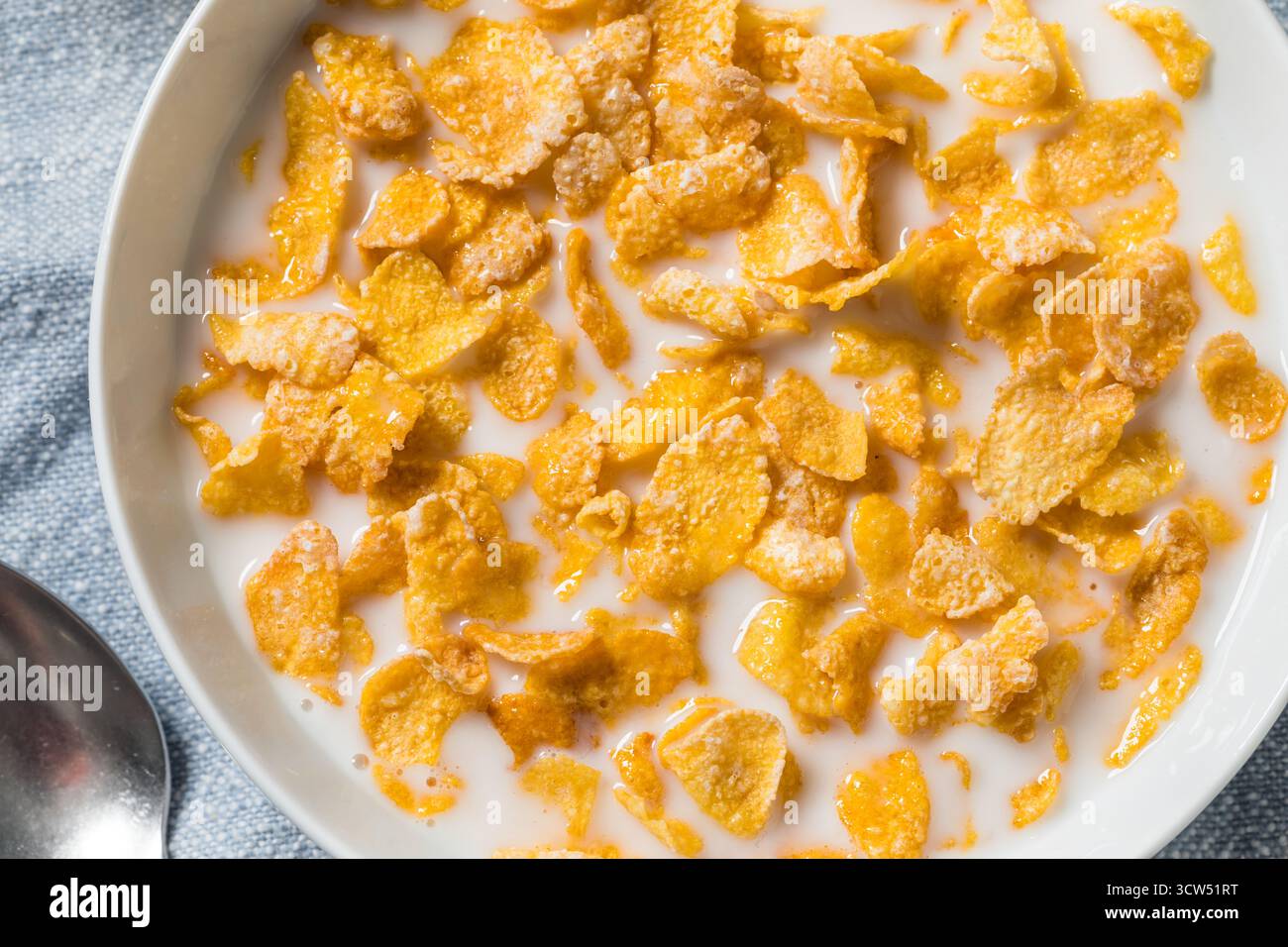 Healthy Frosted Corn Flake Breakfast Cereal with Whole Milk Stock Photo - Alamy