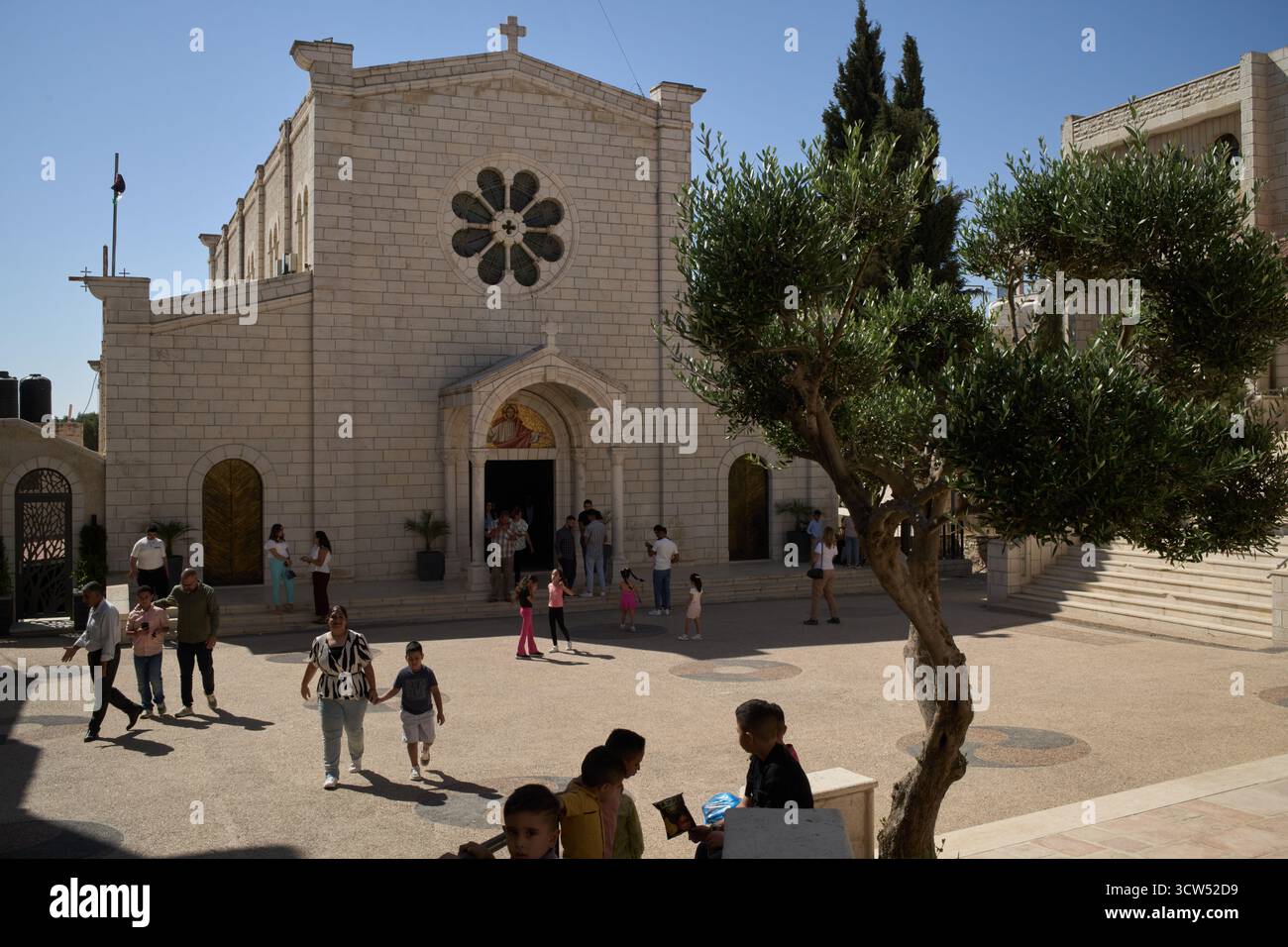 Palestinian parishioners stand outside Christ the Redeemer Church after ...