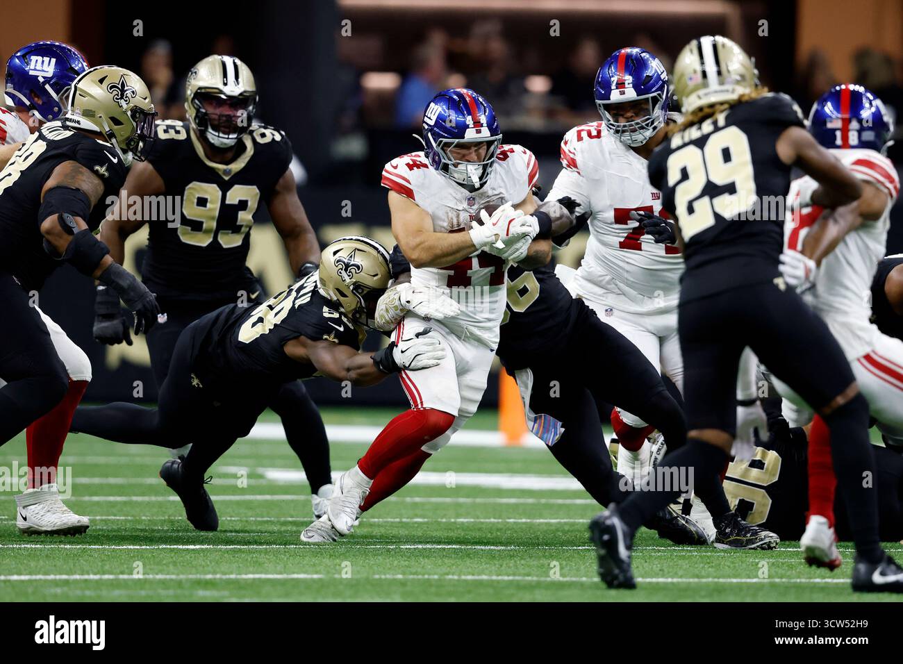 New York Giants running back Cam Skattebo (44) runs past New Orleans ...