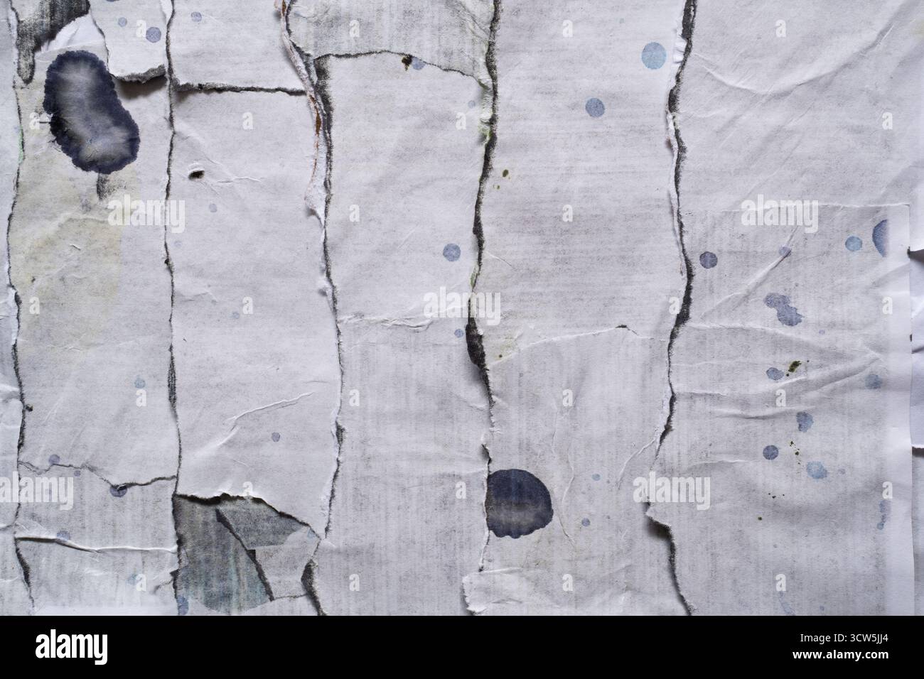 Collage of torn paper with ink blot stain Stock Photo - Alamy