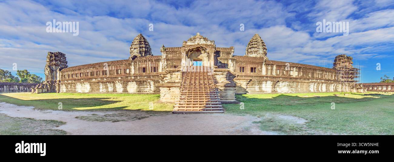 Panoramic front view of Angkor Wat temple with stone stairs and towers ...