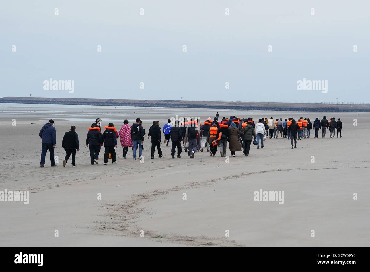 People thought to be migrants on the beach in Gravelines, France ...