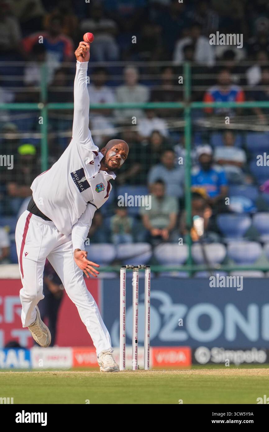 West Indies' captain Roston Chase bowls a delivery on the first day of ...